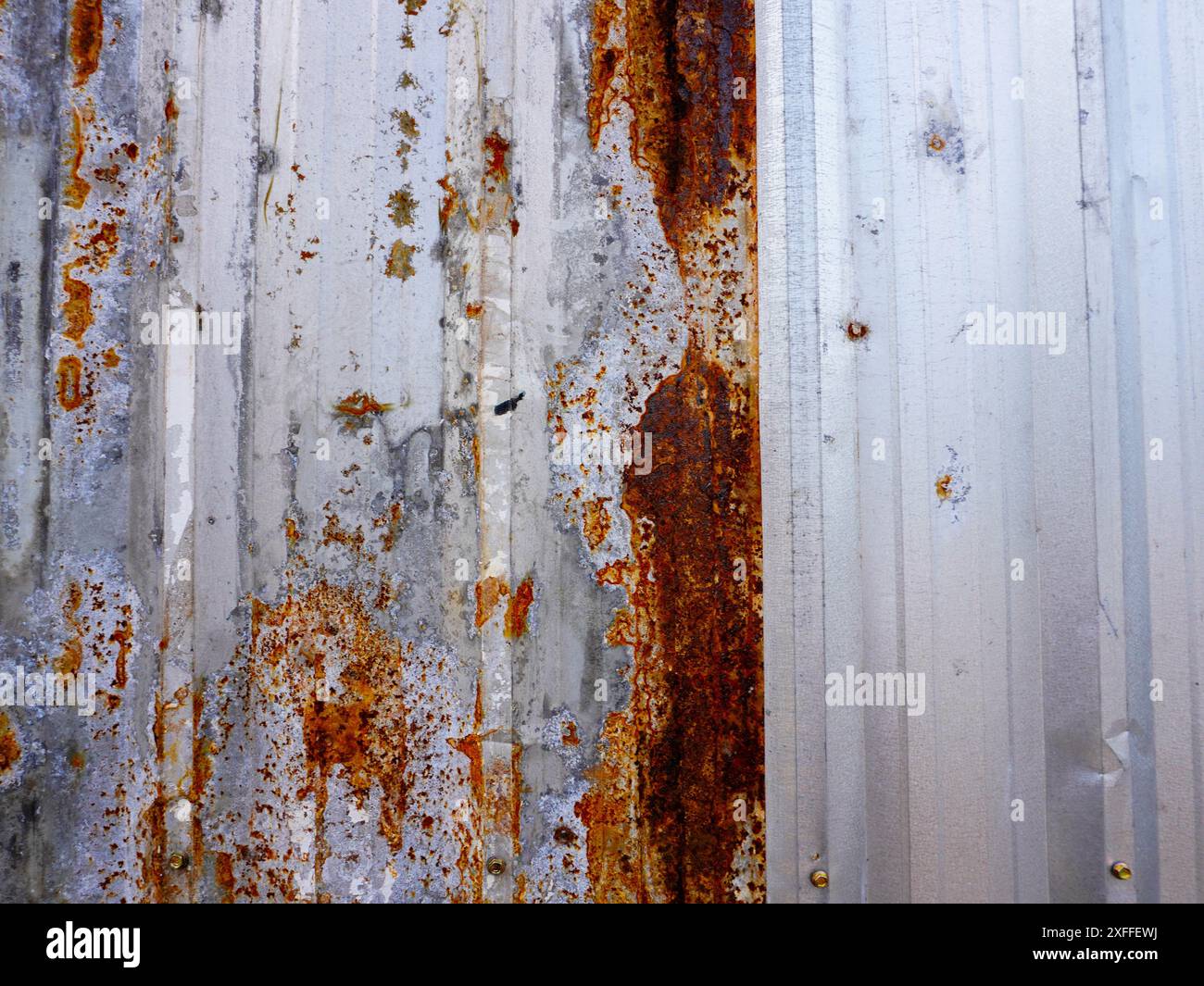 Corroded metal background. The metal walls have rust spots. Rusted ...