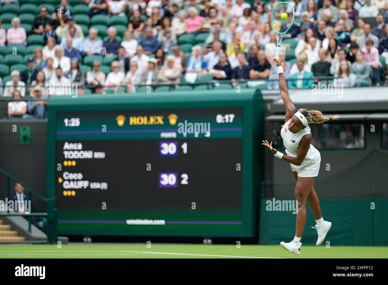 Coco Gauff of the United States serves to Anca Todoni of Romania during ...