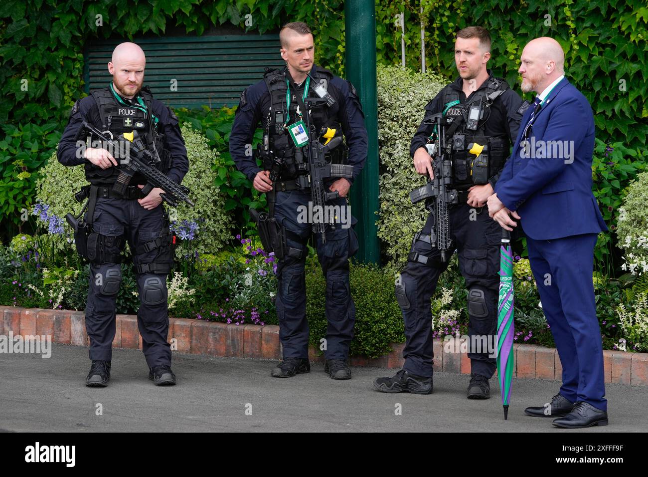 Armed police stand outside Centre Court at the Wimbledon tennis ...