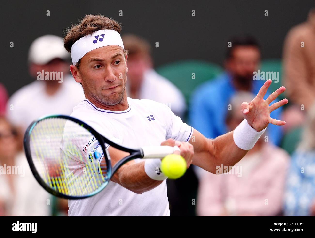 Casper Ruud in action against Fabio Fognini (not pictured) on day three ...