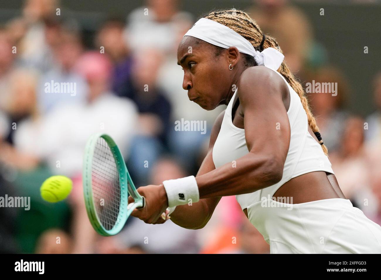 Coco Gauff of the United States plays a backhand return to Anca Todoni ...