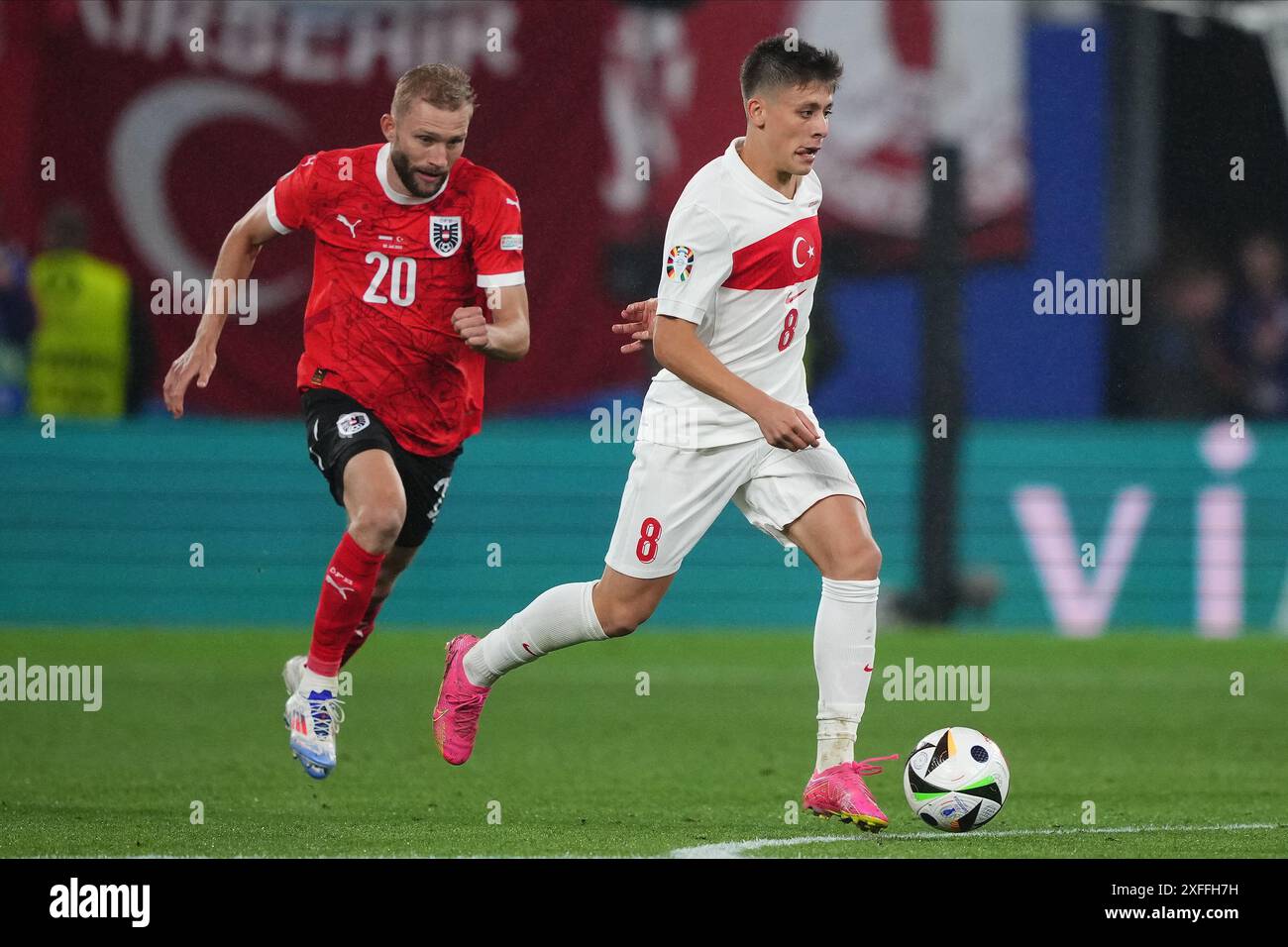 Arda Guler of Turkiye and Konrad Lahmer of Austria during the UEFA Euro ...