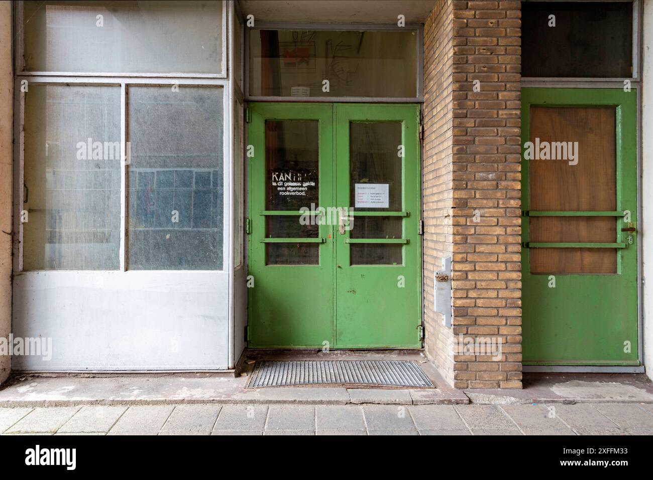 Industrial Building Door A green door inside an industrial, 1950 s ...