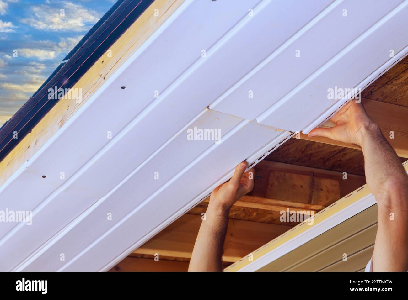 Installation of vinyl soffit plastic boards on ceiling new home Stock ...