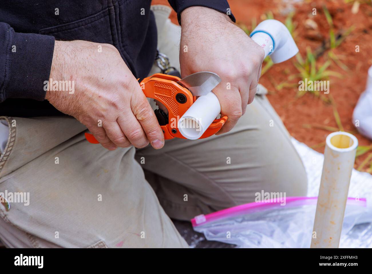 Plumbers use special scissors when installing water pipes system Stock ...
