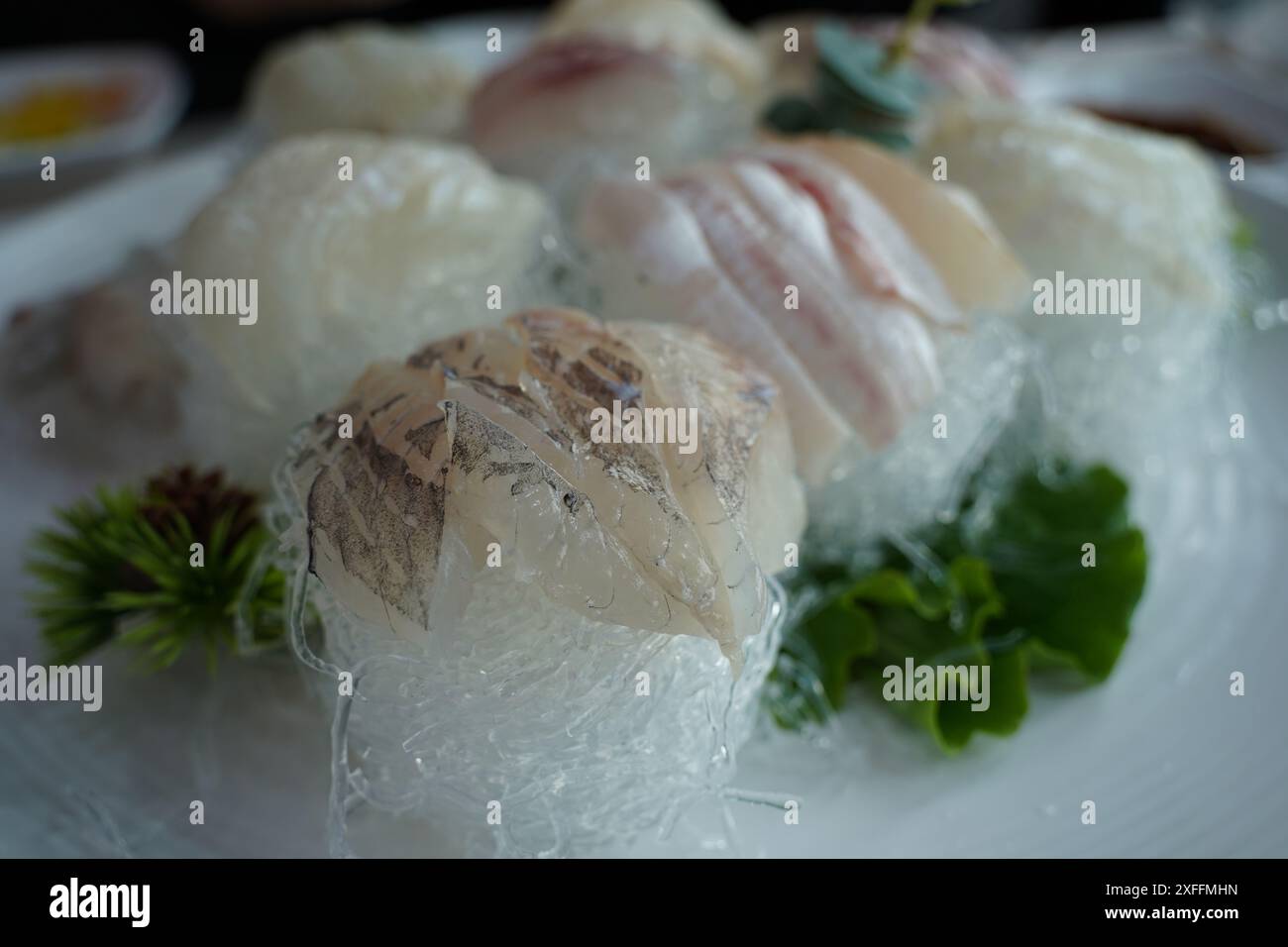 A table of fresh raw fish is served Stock Photo - Alamy