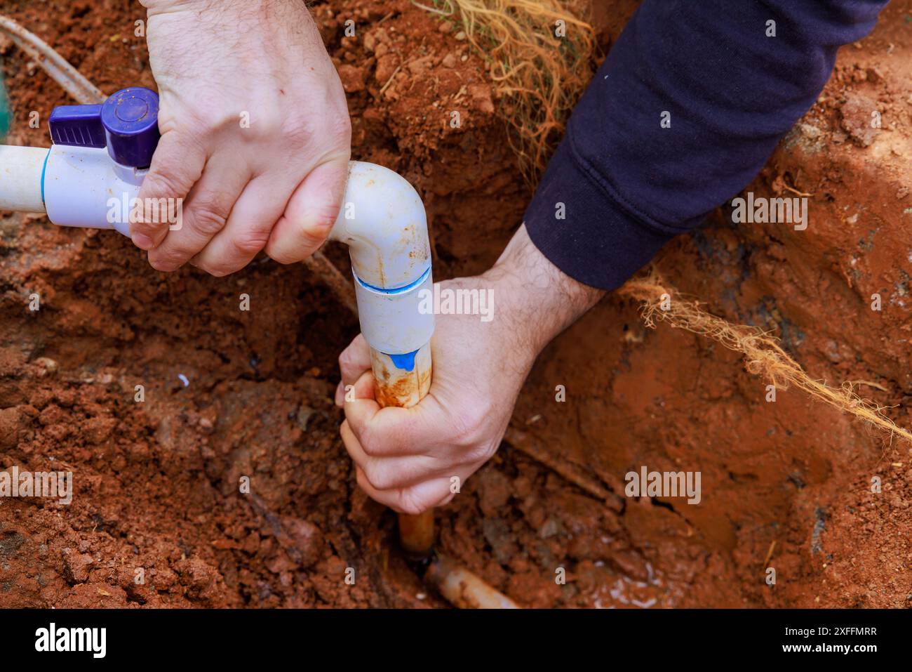 Connecting water to well system pumping water to house Stock Photo - Alamy