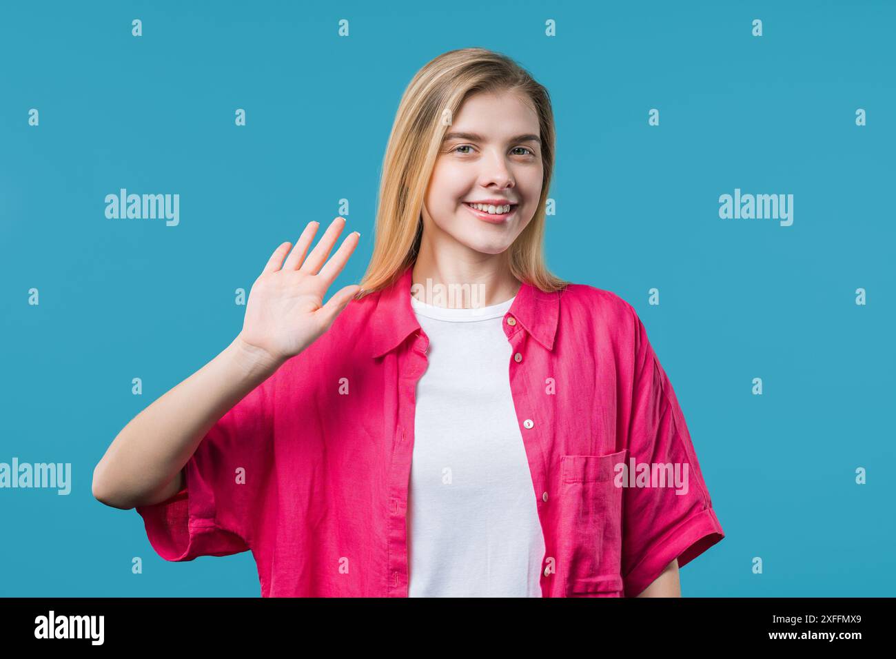 Friendly young adult woman waving hand - Hello, Hi. Greetings. Blue ...