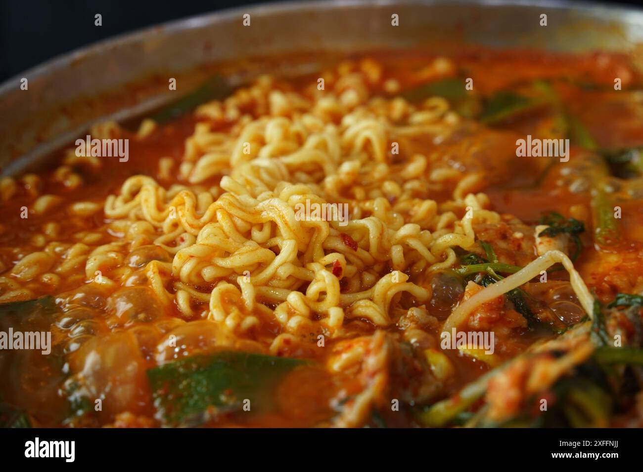 Korean food culture of eating ramen with fish stew seasoned with red ...