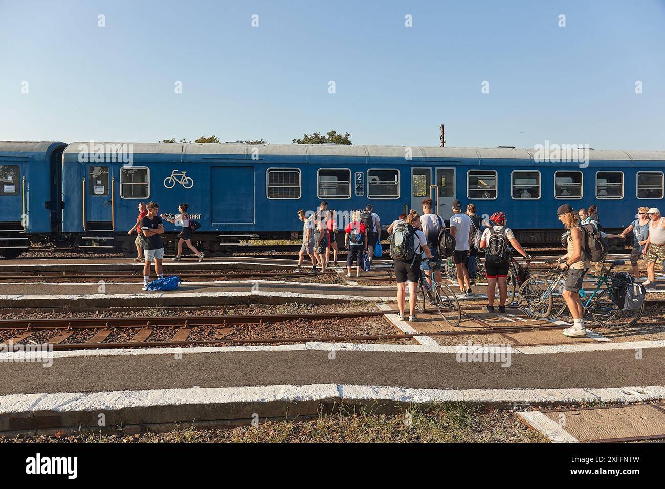 Group of people boarding a train Stock Photo - Alamy