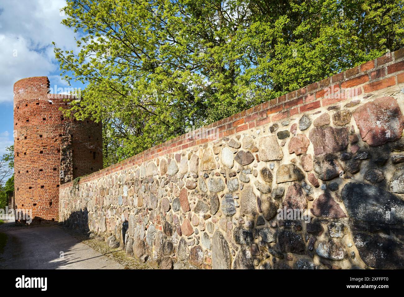 medieval fortifications with a brick tower and a stone wall in Prenzlau ...