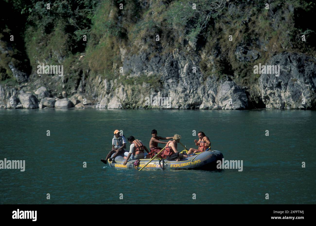 a river rafting Boat on the Holy Ganges River with the city of ...