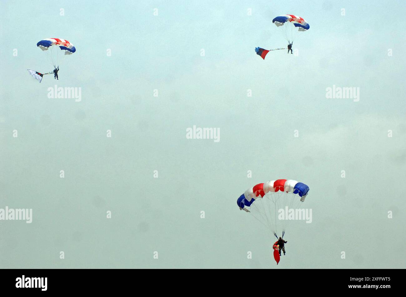 Paratroopers land on the National Parade Square Wednesday on ...