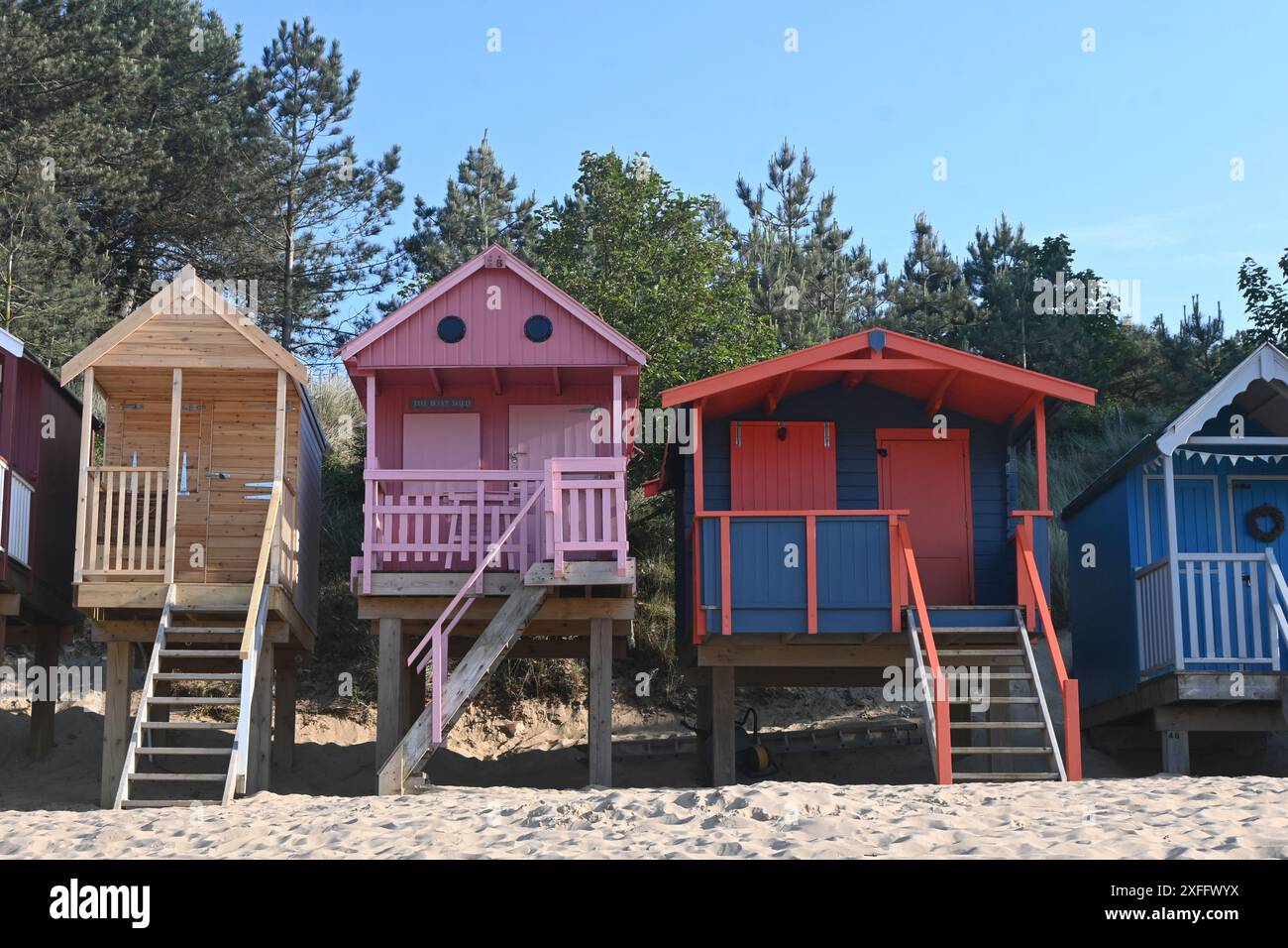 Group colourful beach huts hi-res stock photography and images - Alamy