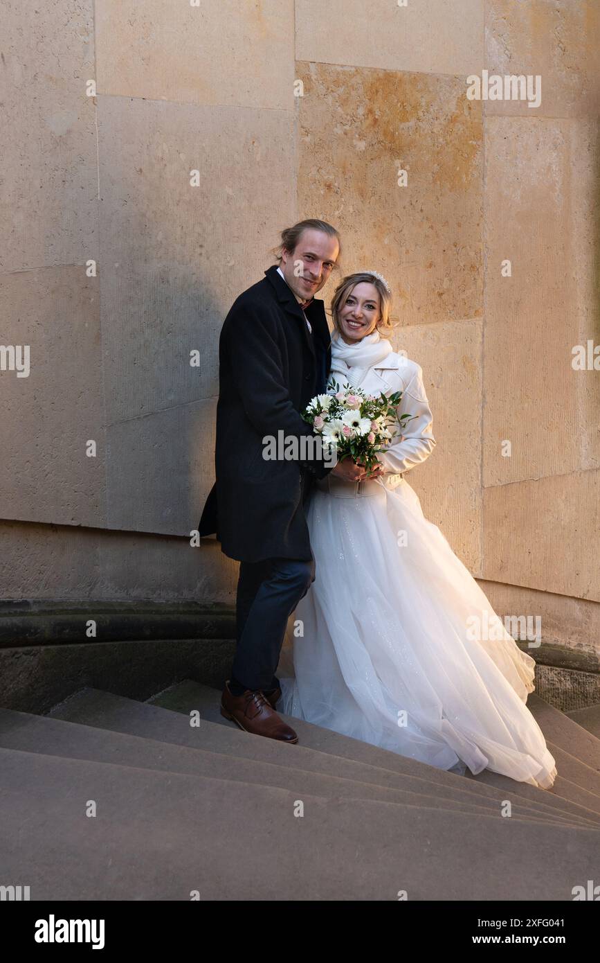 Wedding couple. The bride and groom are standing on the steps. View ...