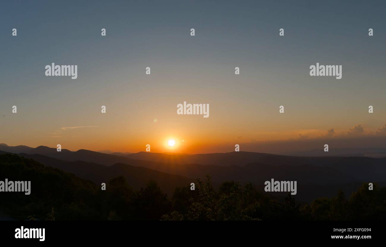 Beautiful sunset sky over forested hi-res stock photography and images ...