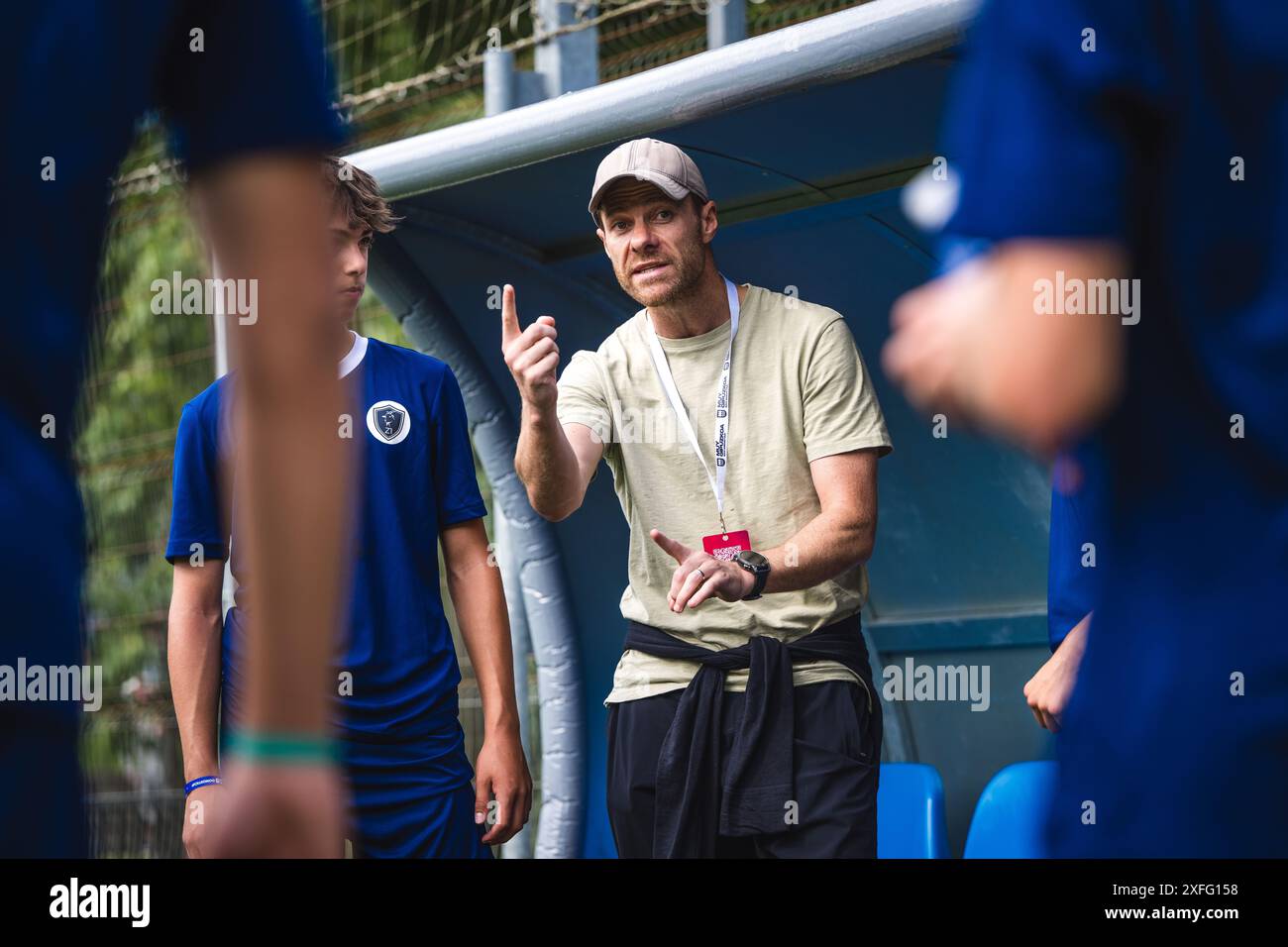Xabi Alonso training and giving instructions to some young soccer ...