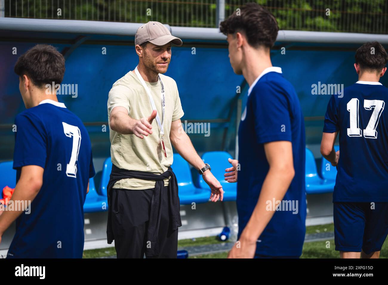 Xabi Alonso training and giving instructions to some young soccer ...