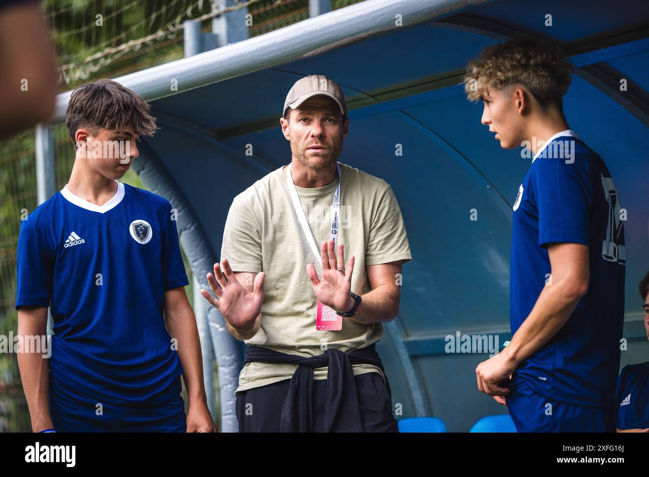 Xabi Alonso training and giving instructions to some young soccer ...