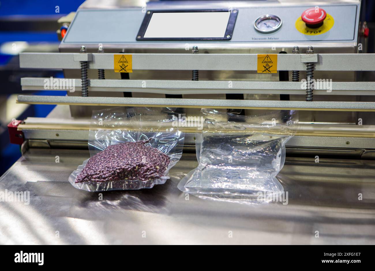 Vacuum heat package sealing machine for food packaging Stock Photo - Alamy