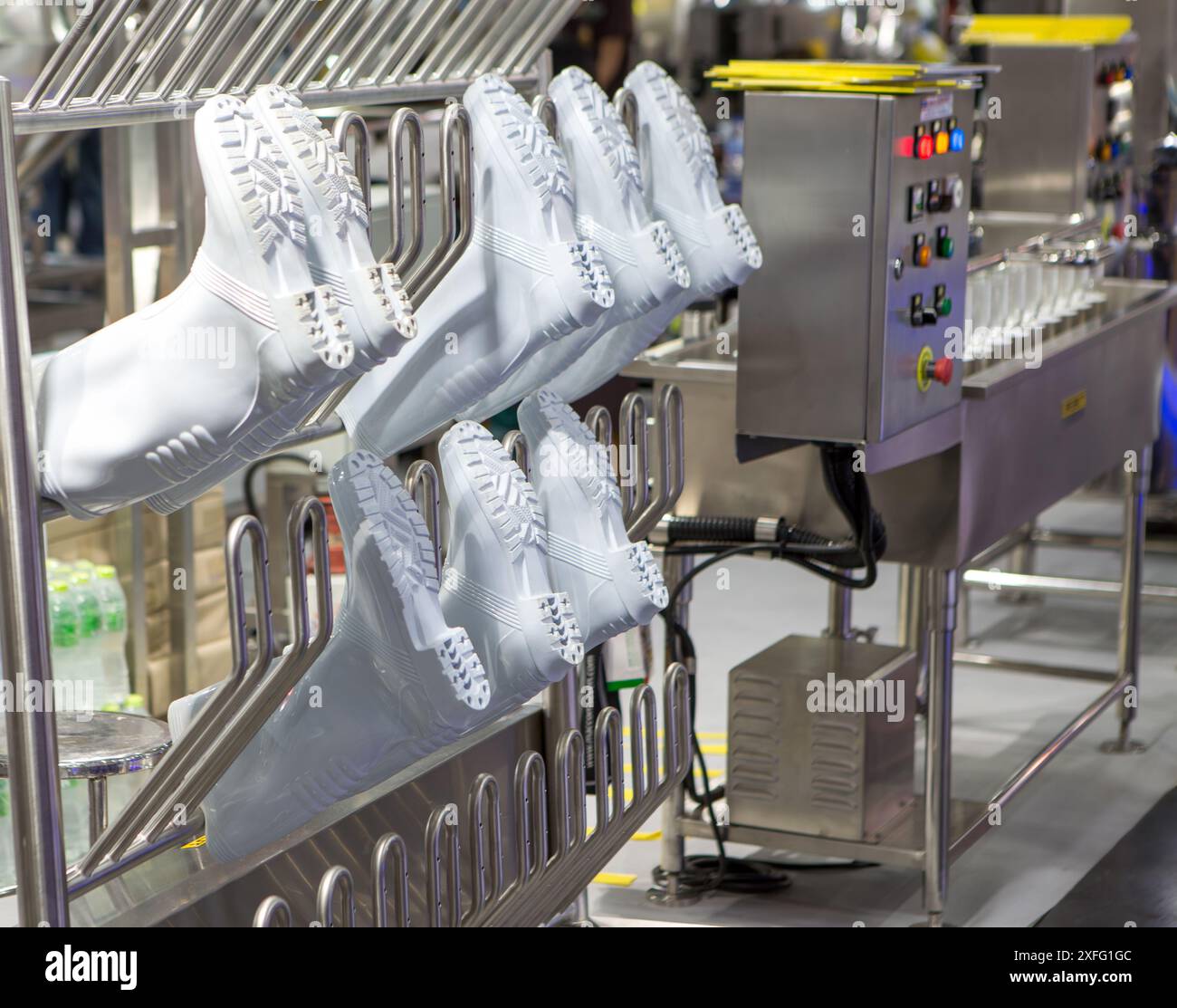 White rubber boots footwear in manufacturing factory Stock Photo - Alamy