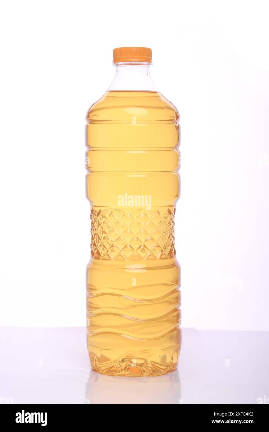 front view of oil in plastic bottle with yellow lid isolated on white ...
