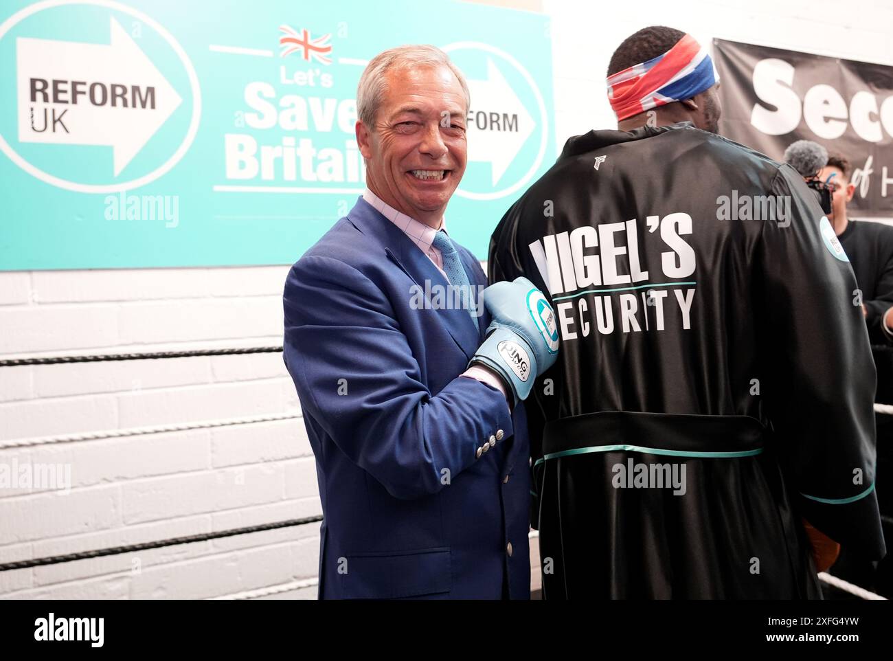 Reform UK leader Nigel Farage (left) and boxer Derek Chisora at a ...