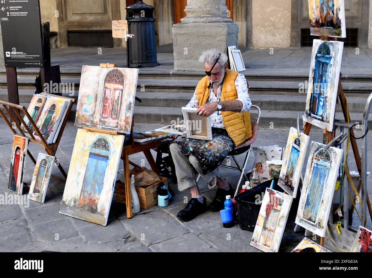 Italian street artist working on the streets of Florence in Italy Stock ...