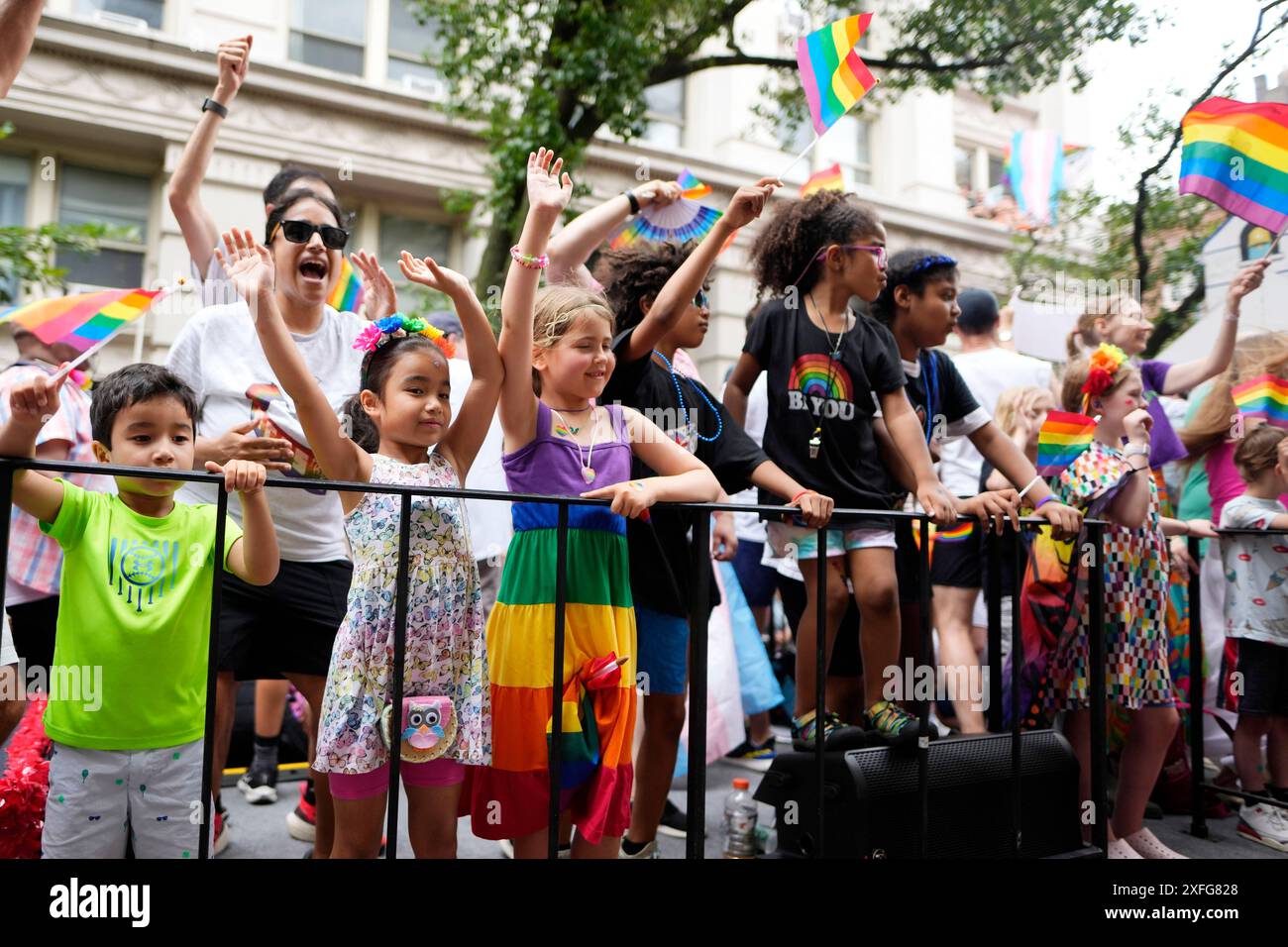 Paradegoers from The Calhoun School ride a float in the NYC Pride March ...