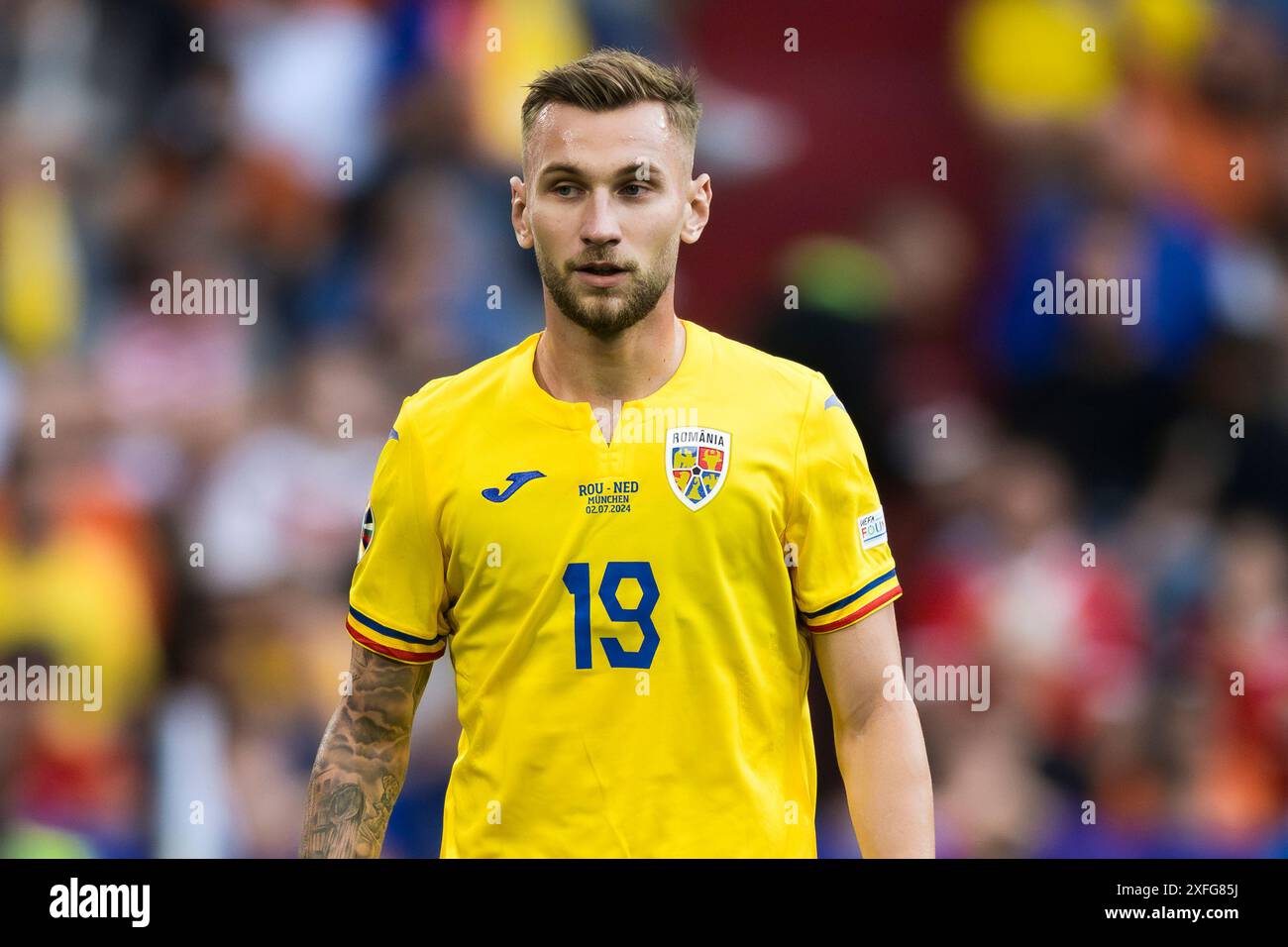 Munich, Germany. 2 July 2024. Denis Dragus of Romania looks on during ...