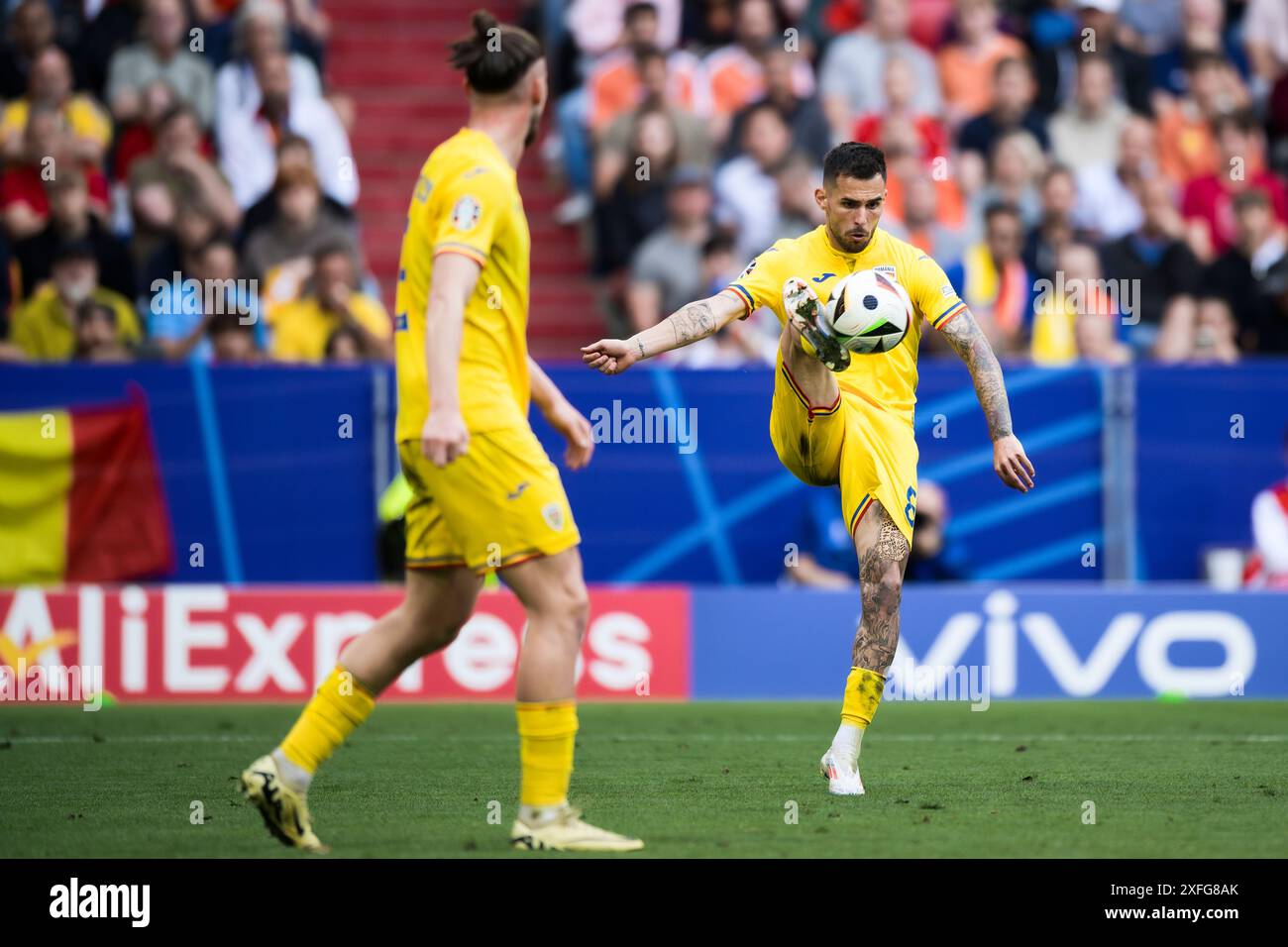 Munich, Germany. 2 July 2024. Marius Marin of Romania in action next to ...