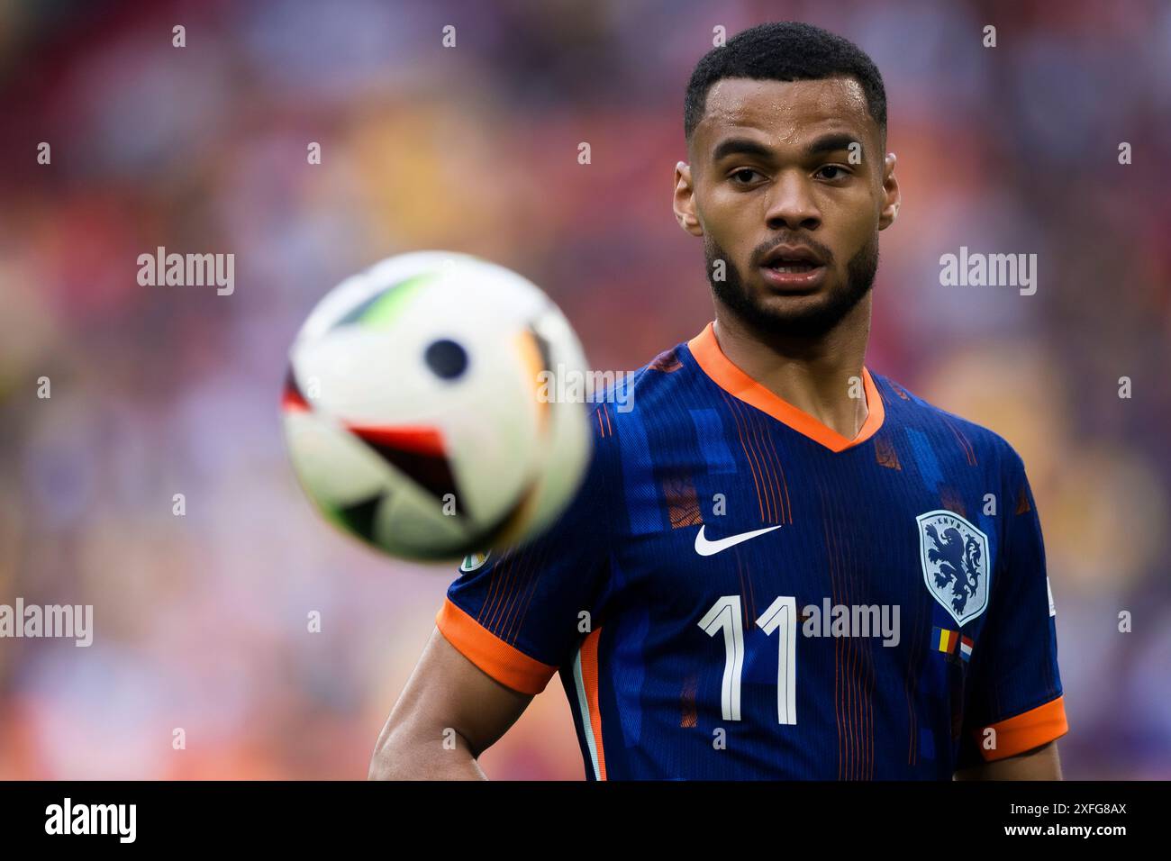 Munich, Germany. 2 July 2024. Cody Gakpo of Netherlands eyes the ball ...