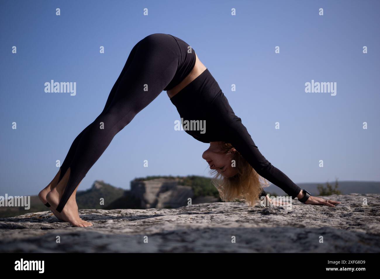 Yoga gymnastics on rock hi-res stock photography and images - Alamy