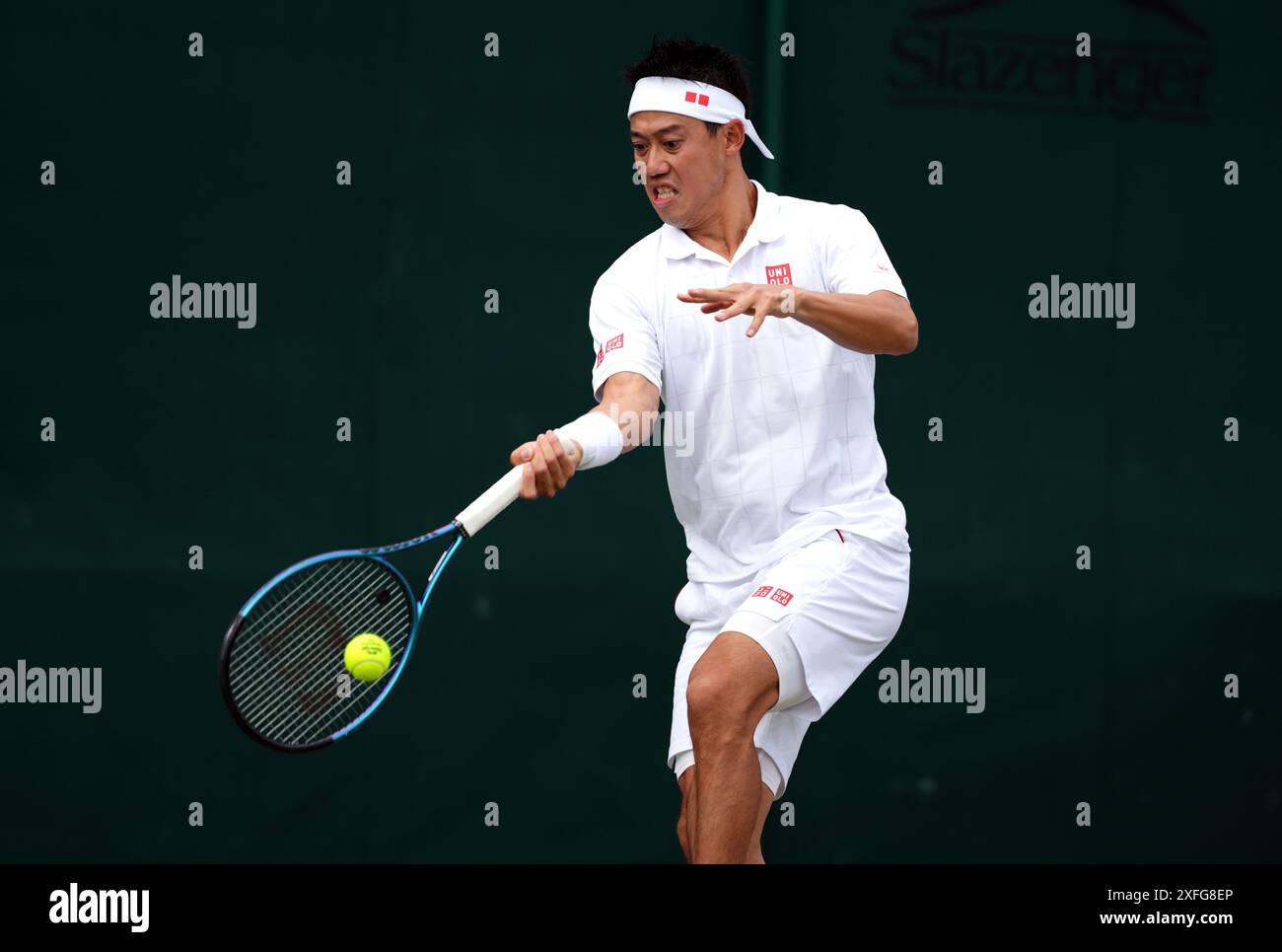 Kei Nishikori during his match against Arthur Rinderknech on day three ...