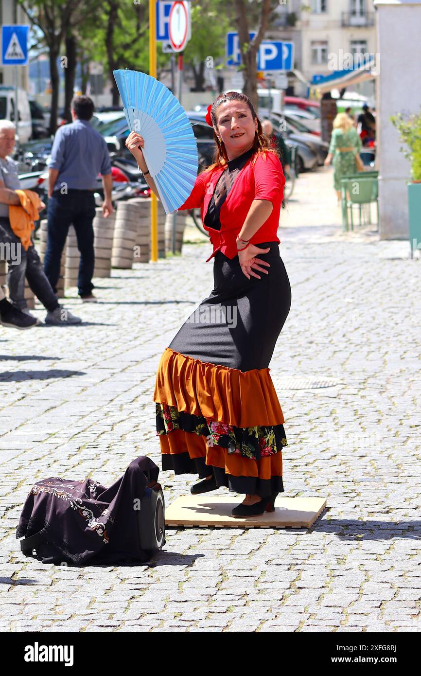 Flamenco dance teacher Gloria Rios performs under midday heat in a ...