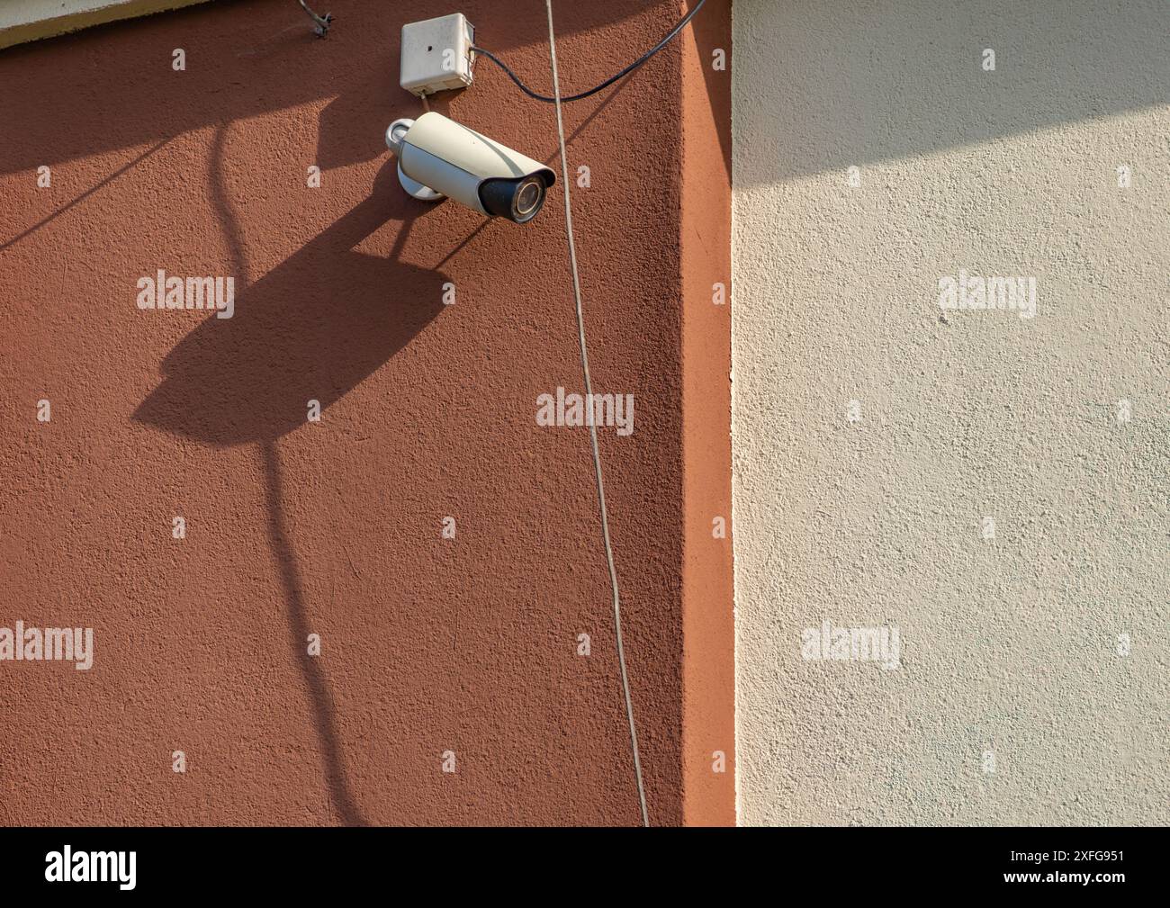 Camera hanging on the wall for video surveillance Stock Photo - Alamy