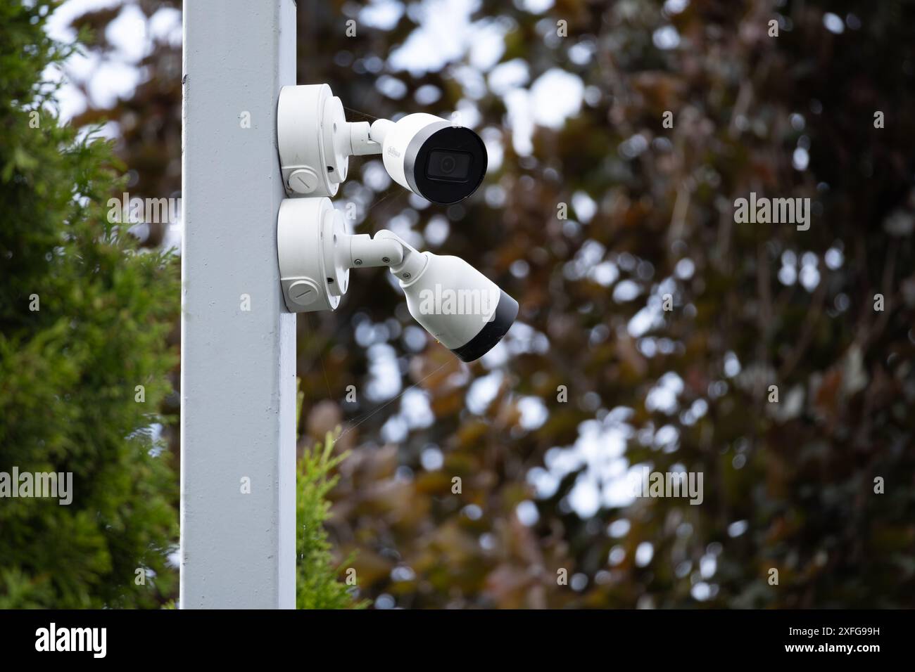 Camera hanging on the wall for video surveillance Stock Photo - Alamy