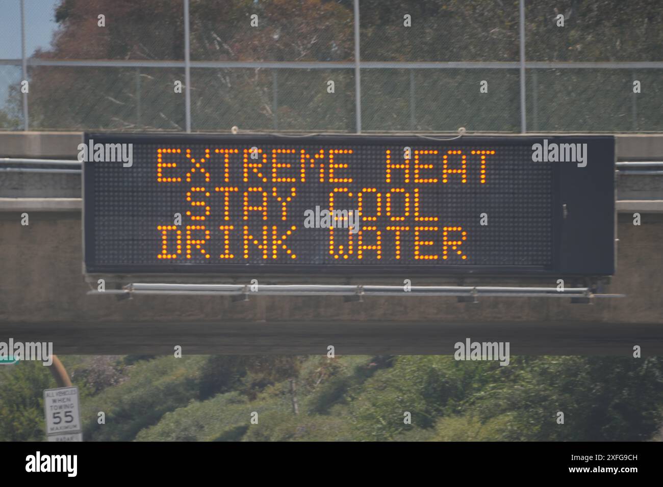 An Extreme Heat, Stay Cool, Drink Water sign on a message board along ...