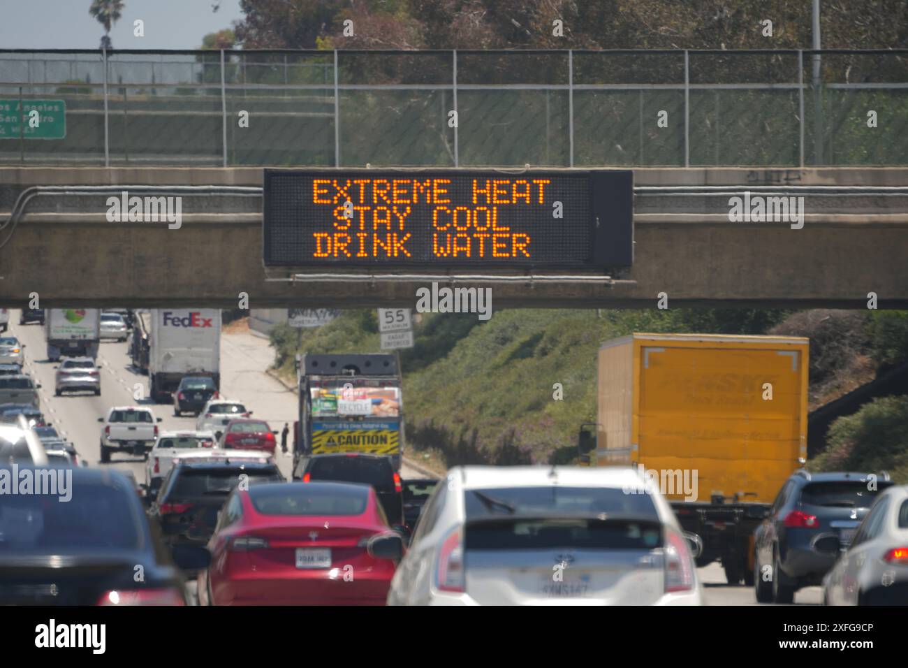 An Extreme Heat, Stay Cool, Drink Water sign on a message board along ...