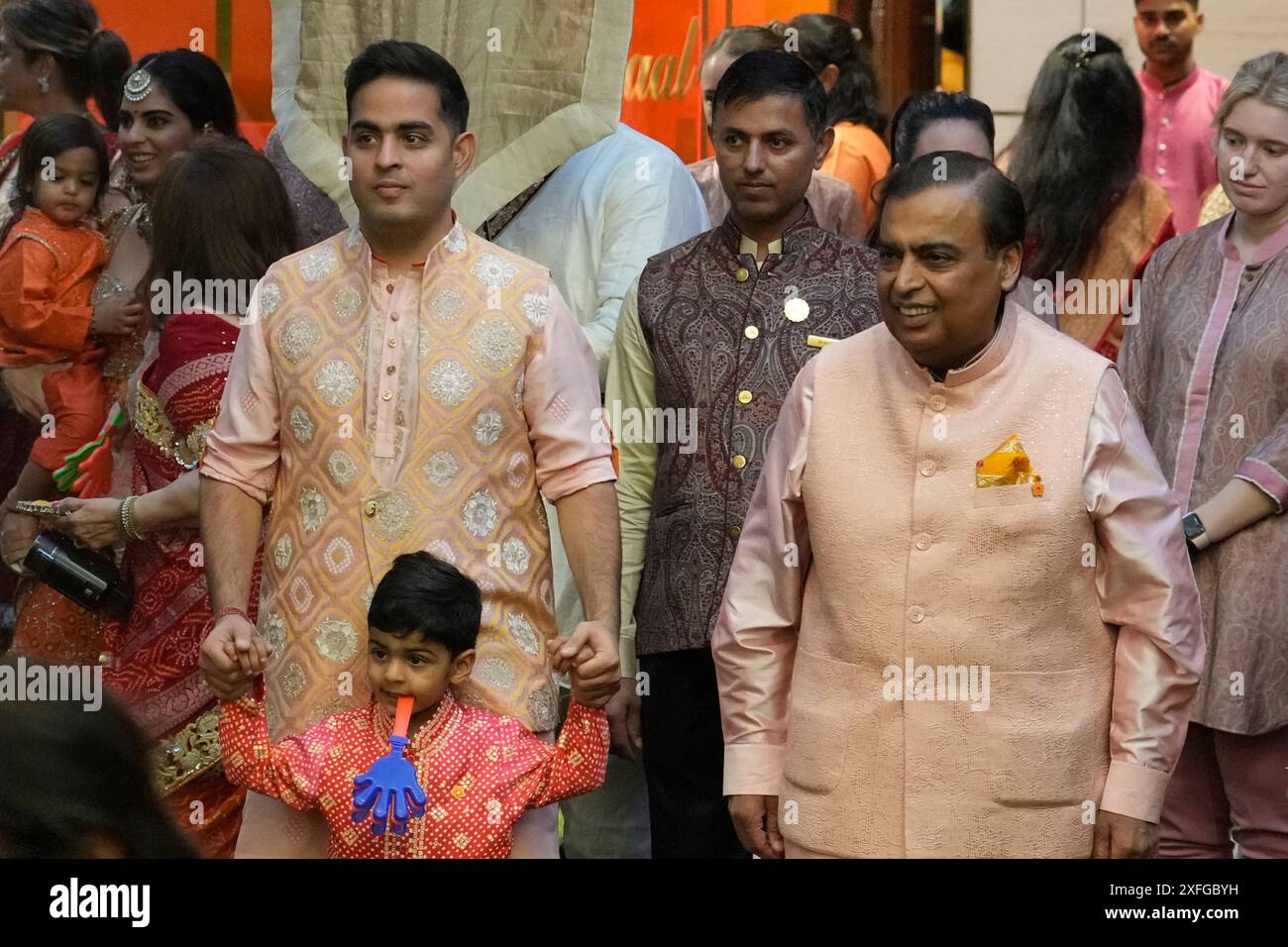 Chairman of Reliance Industries Limited Mukesh Ambani, right, along ...