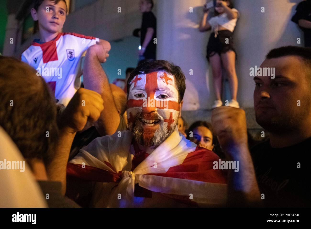 Tbilisi, Georgia. 03rd July, 2024. A man with the Georgian flag painted ...