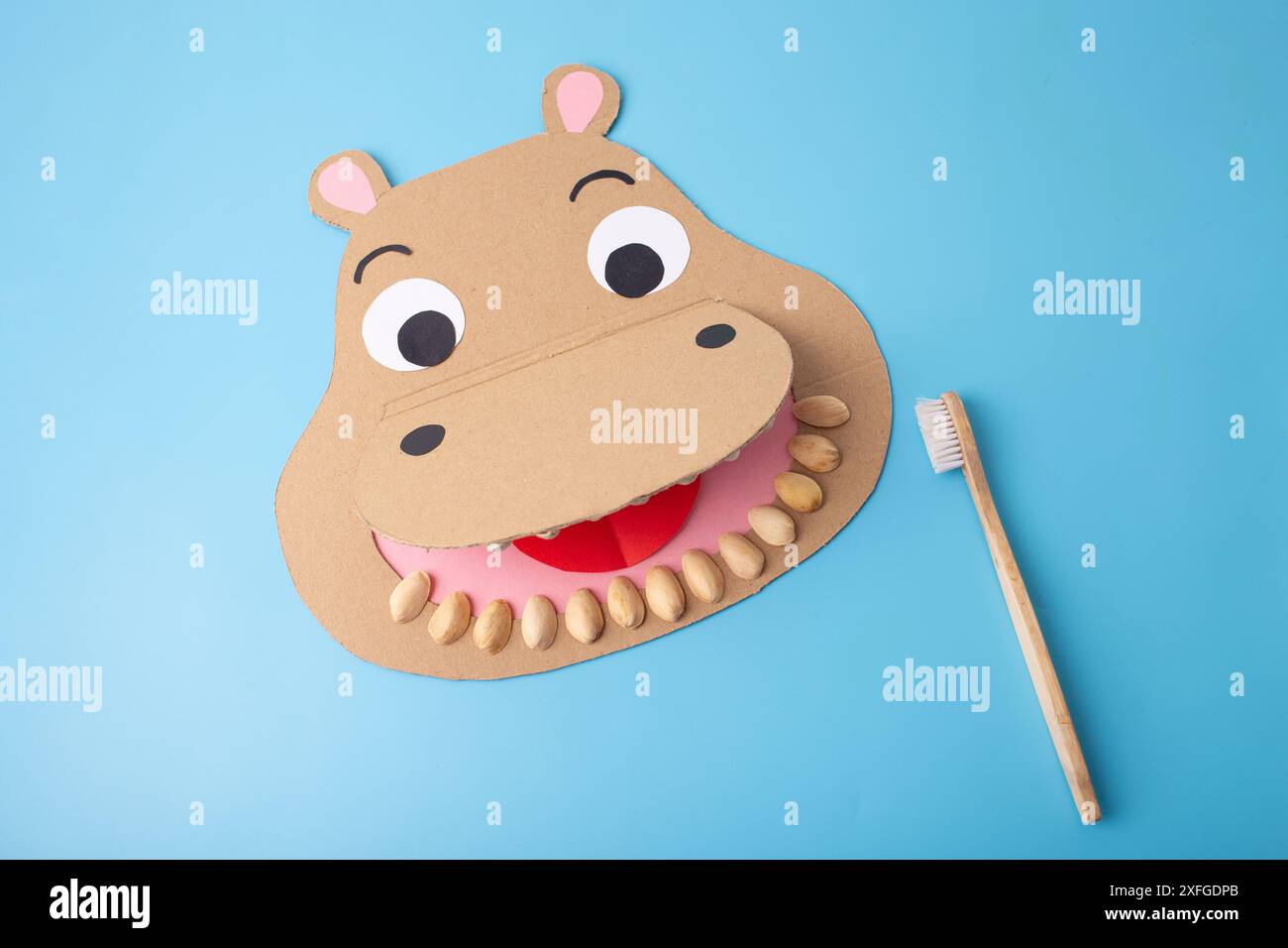 Creative craft project featuring paper made hippo head with wide open ...