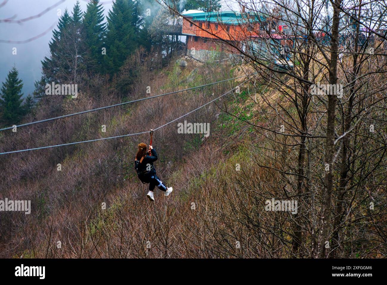 A picturesque moment capturing a woman sliding gracefully with her ...