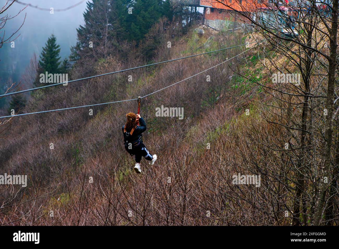 A picturesque moment capturing a woman sliding gracefully with her ...
