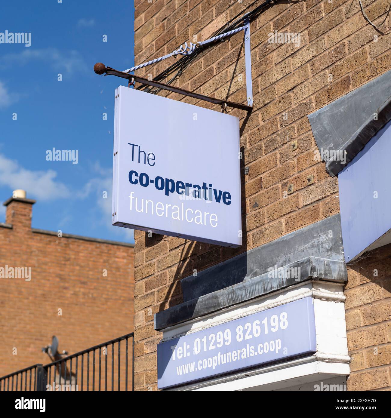 A front of the building sign for The Co-Operative funeral care Stock ...