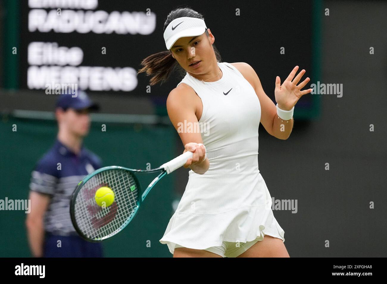Emma Raducanu of Britain plays a forehand return to Elise Mertens of ...