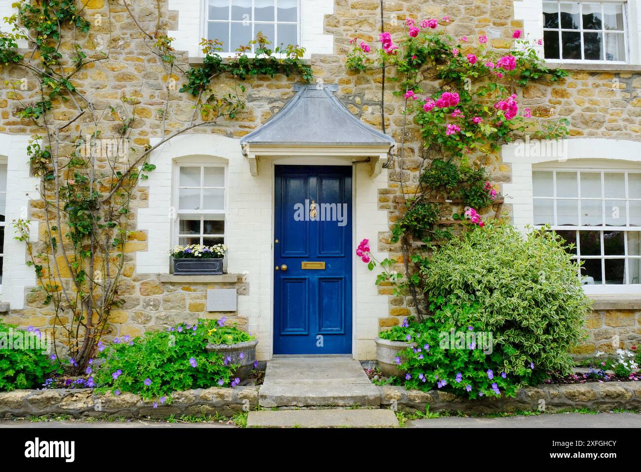 Front facade of a pretty country cottage, Netherbury, Dorset, UK - John ...