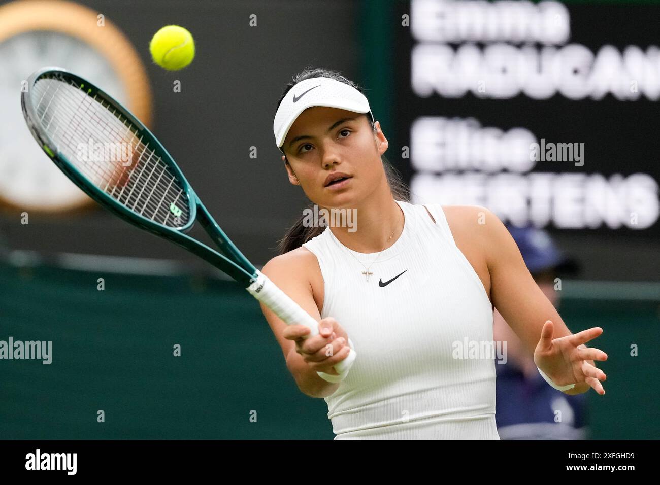 Emma Raducanu of Britain plays a forehand return to Elise Mertens of ...
