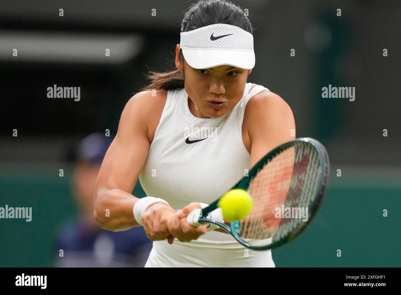 Emma Raducanu of Britain plays a backhand return to Elise Mertens of ...