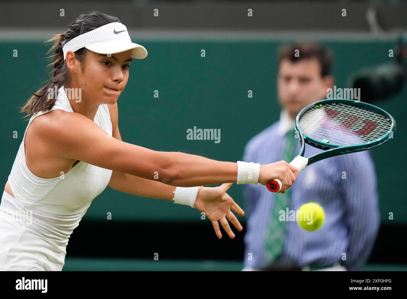 Emma Raducanu of Britain plays a backhand return to Elise Mertens of ...